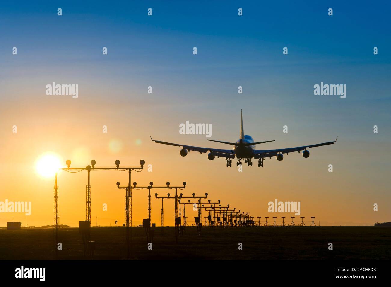 Aeroplane landing at sunset. Boeing 747 landing at sunset at Vancouver ...