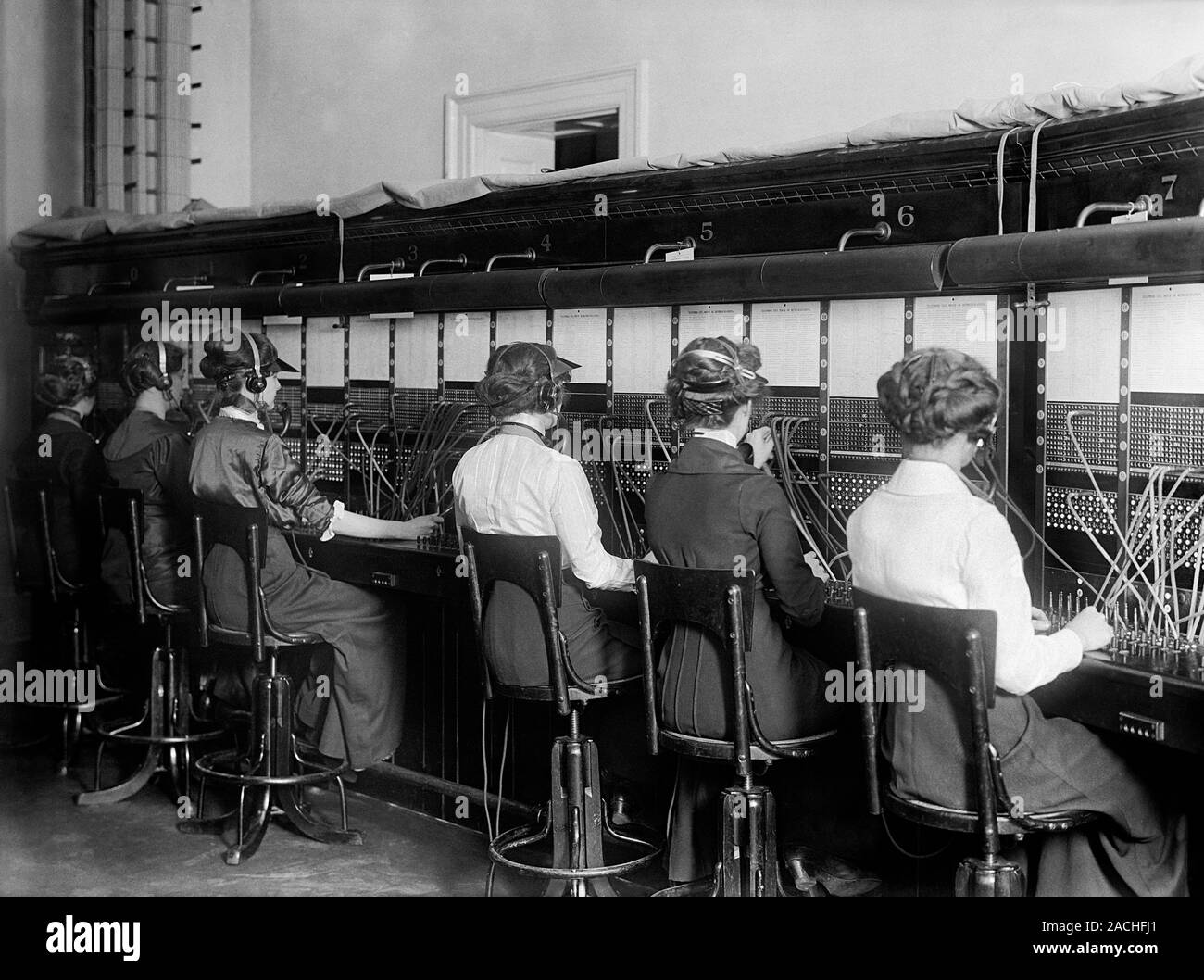 Telephone operators working in a telephone exchange Stock Photo - Alamy