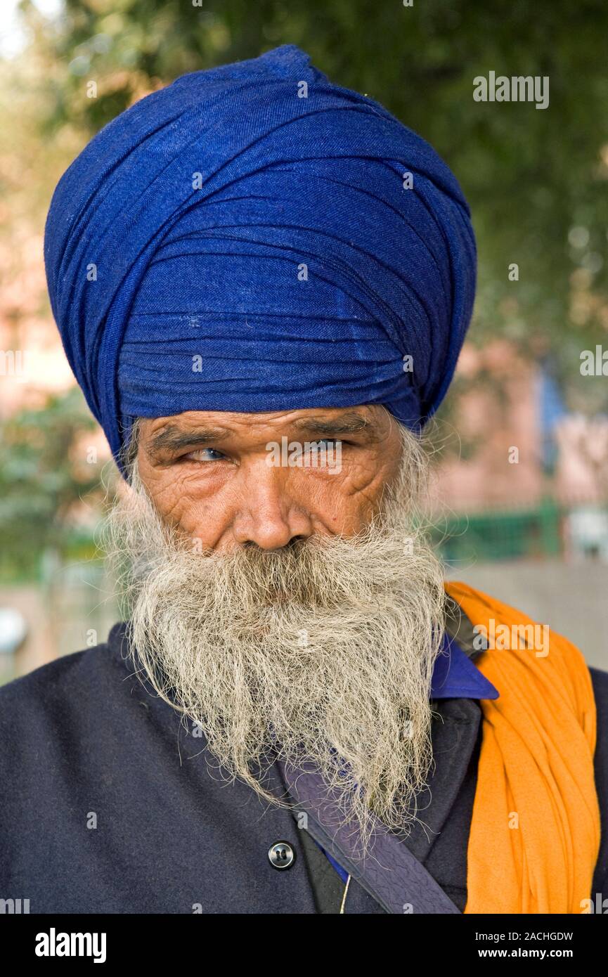 Elderly man with crossed eye. This Sikh temple guard has an sight ...
