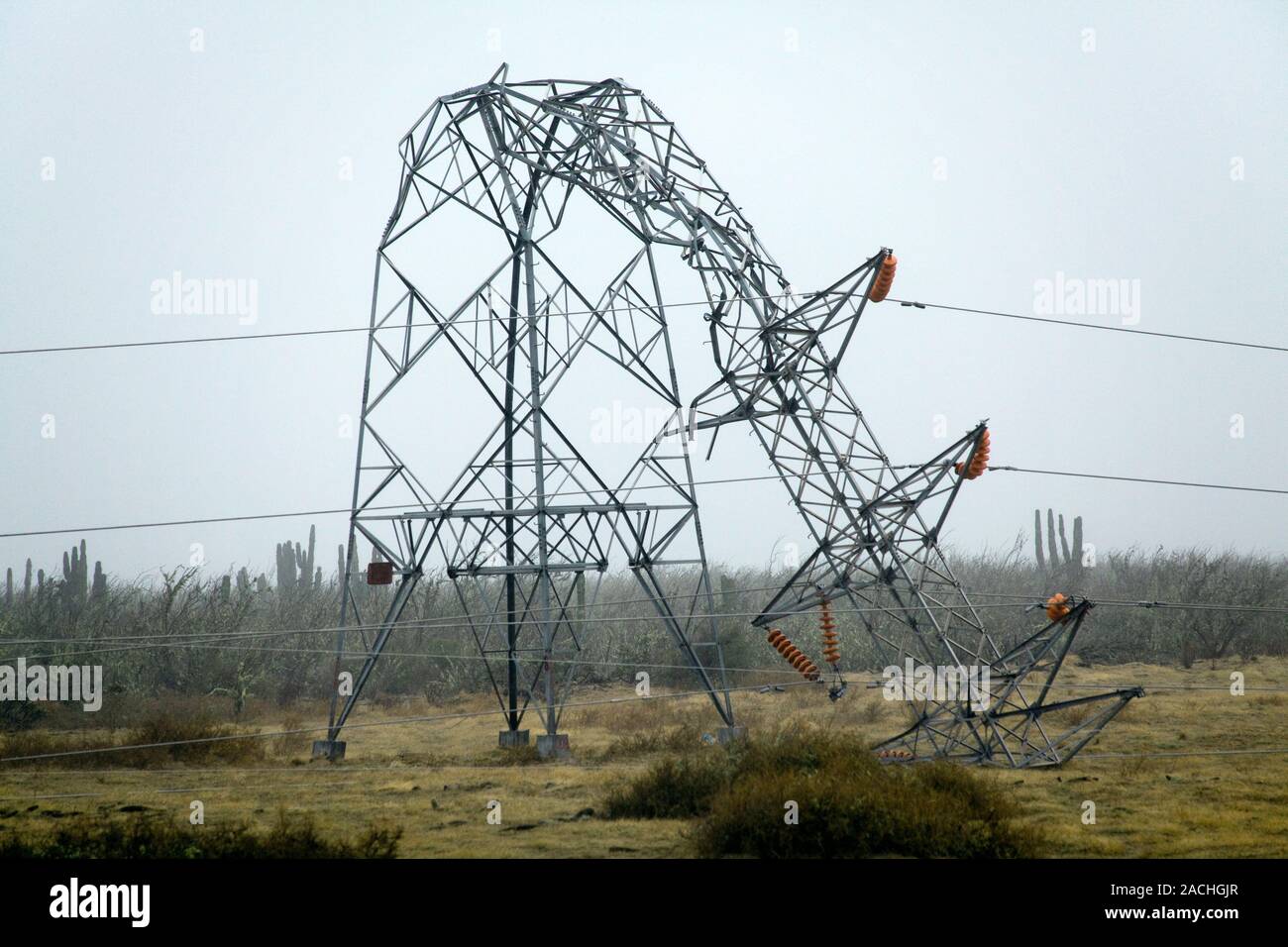 Hurricane damage. Collapsed pylon that was bent over by hurricane-force ...