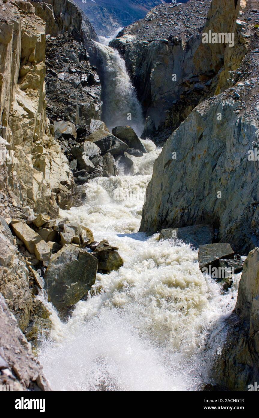 Waterfall from glacial meltwater. Glaciers are rivers of ice that form ...