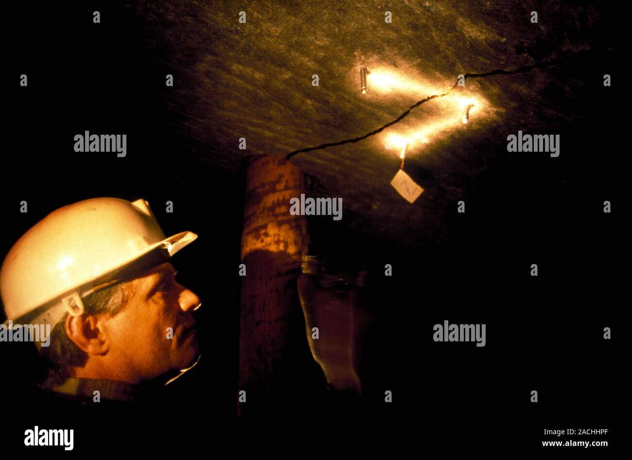 Ground movement, Wieliczka Salt Mine. Mining engineer inspecting a ...