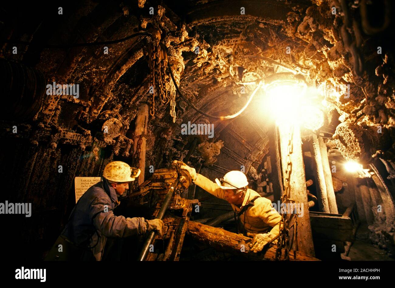 Flood defences. Miners in the Wieliczka Salt Mine using a cement ...