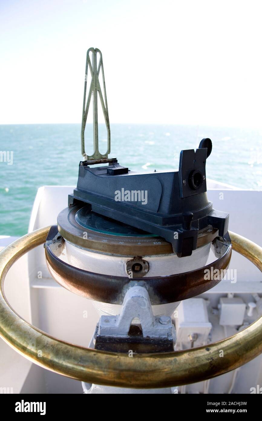 Bearing compass on a ship. The bearing is made by noting the direction ...
