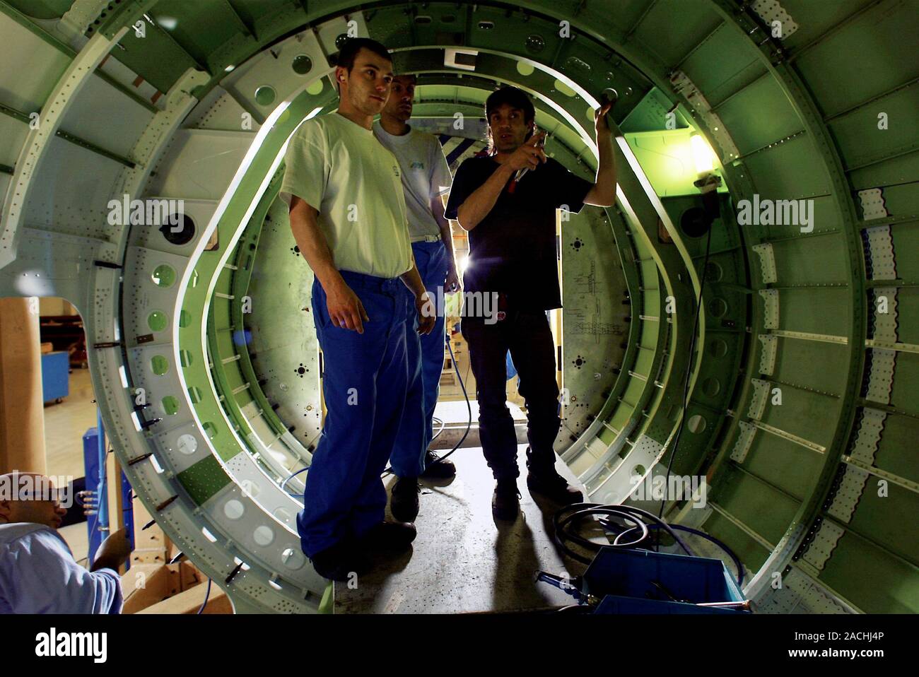 Aeroplane construction. Workers assembling an aircraft in an aeroplane ...