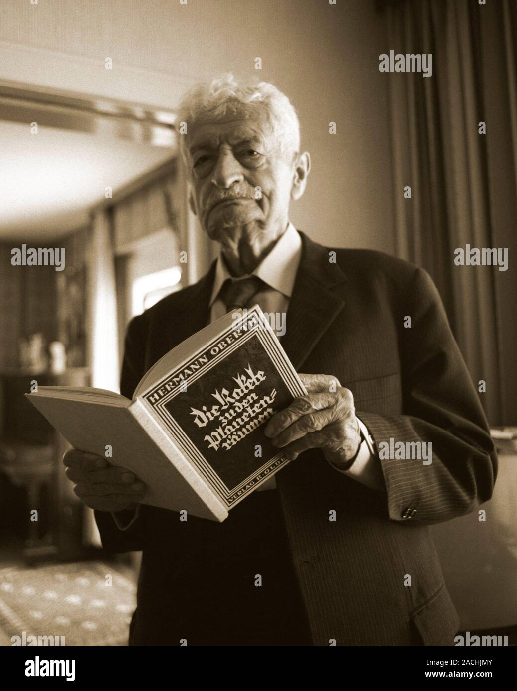 Hermann Oberth (1894-1989), German rocket pioneer, holding his book on ...