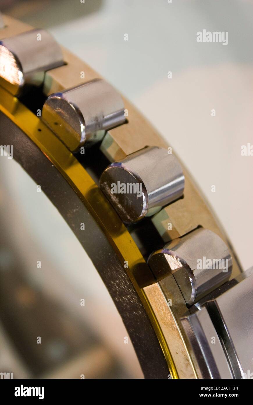 Roller bearings displayed with part of the race or cage removed so that ...