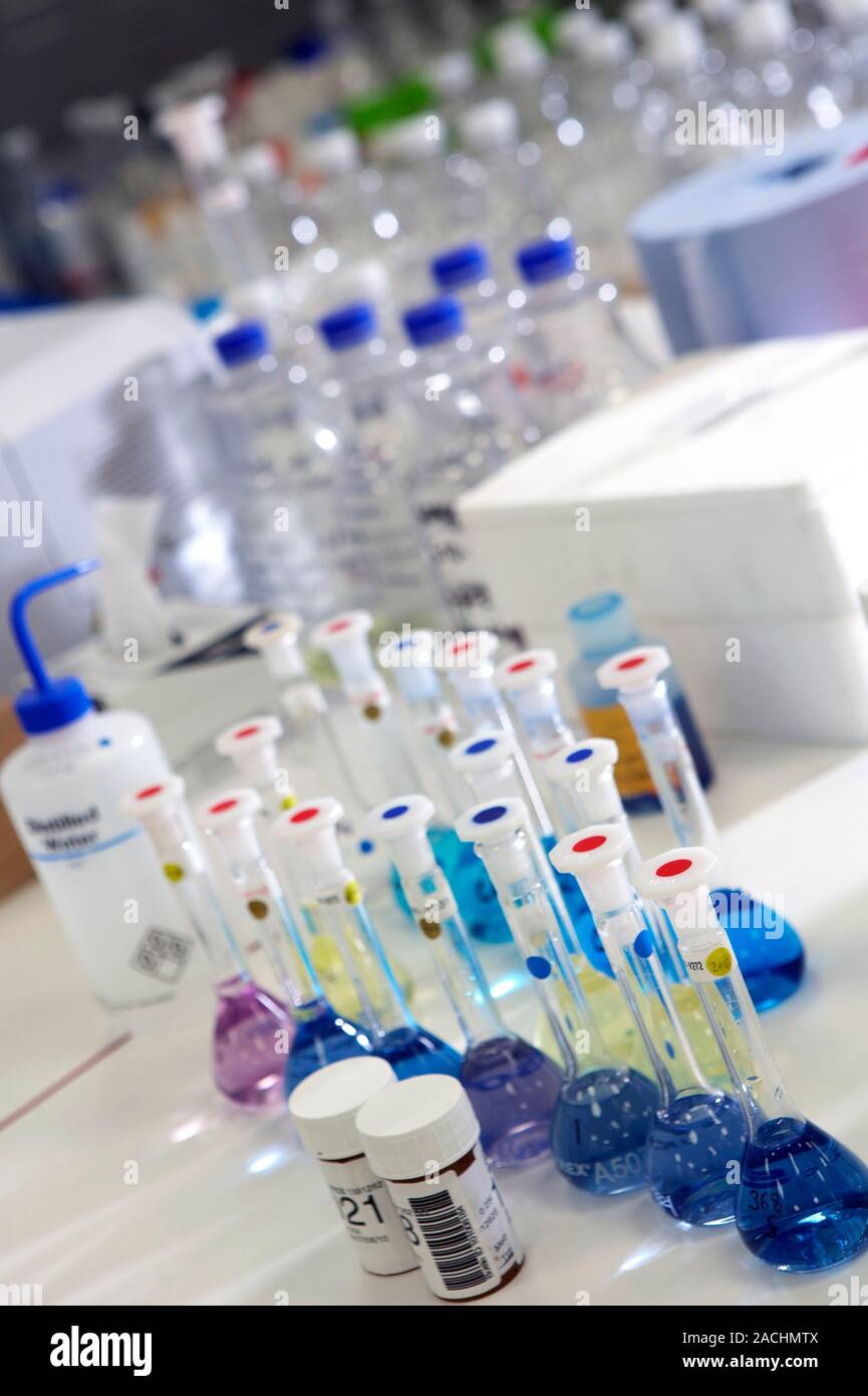 Water purity test. Samples of water being tested for their pH levels ...