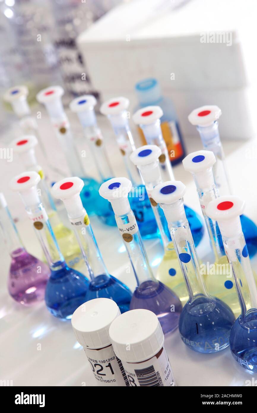 Water purity test. Samples of water being tested for their pH levels ...