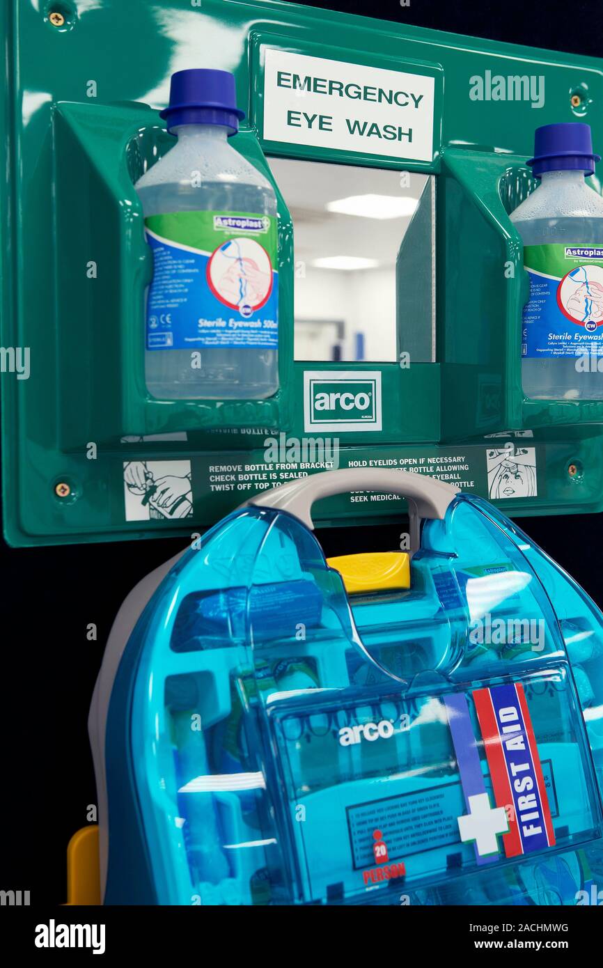 Laboratory first aid. Emergency eye wash station and first aid kit in a ...