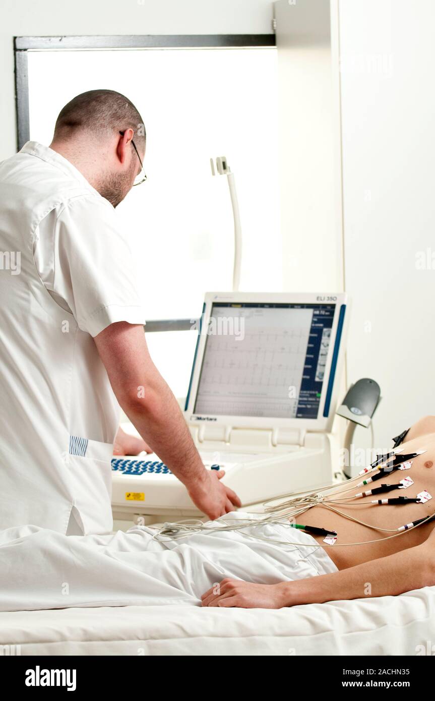 Heart monitoring. Patient undergoing an electrocardiography (ECG ...