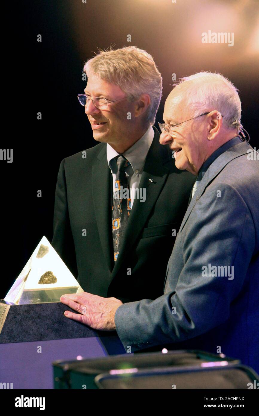 Apollo 15 moon rock. Alan Bean (born 1932, right), US astronaut, and ...