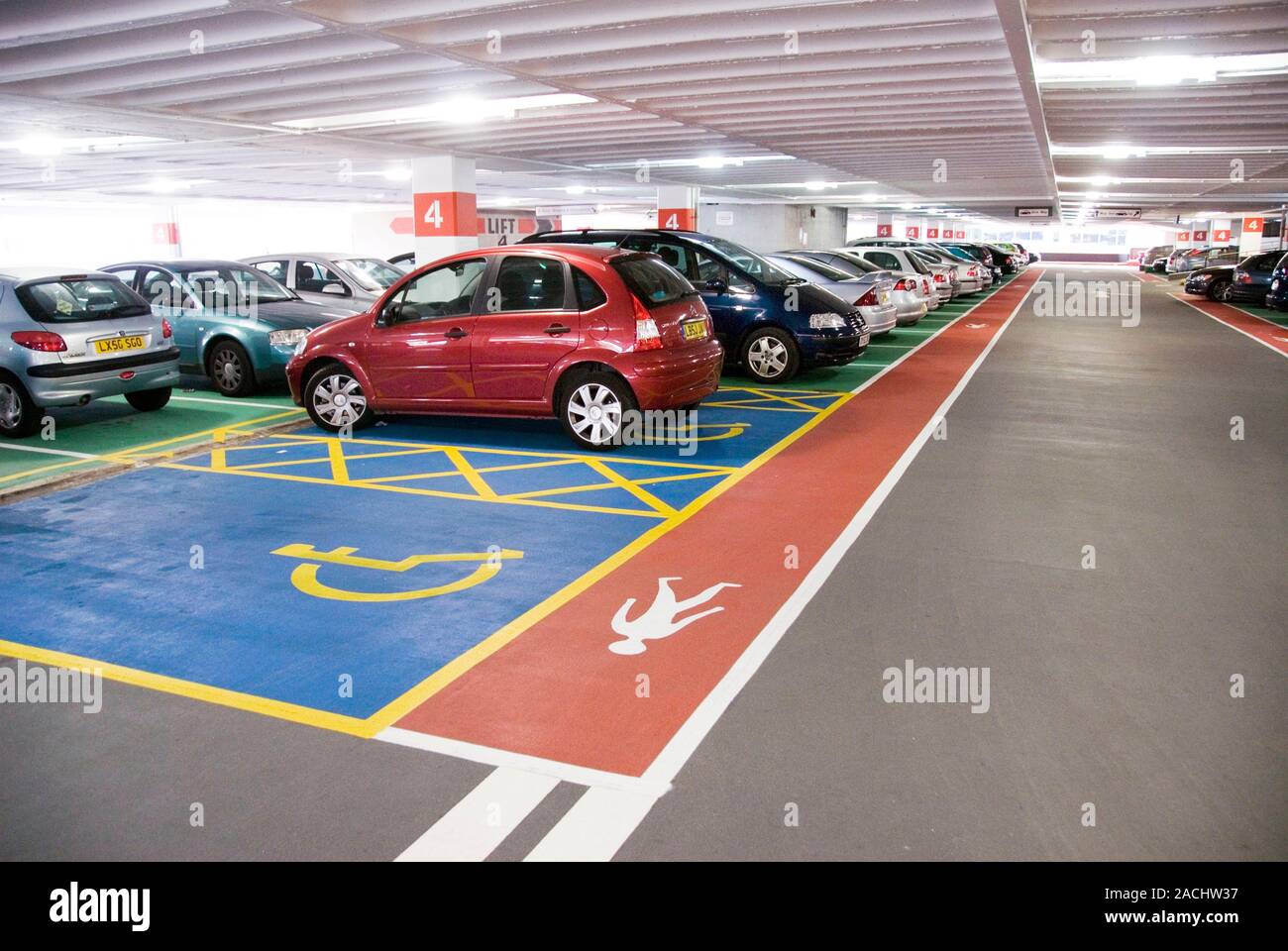 Multi-storey car park. Refurbished multi-storey car park with road ...
