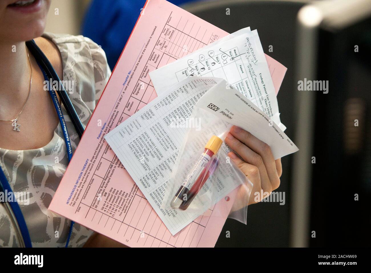 Hospital staff. Close-up of a doctor on a hospital ward holding a ...