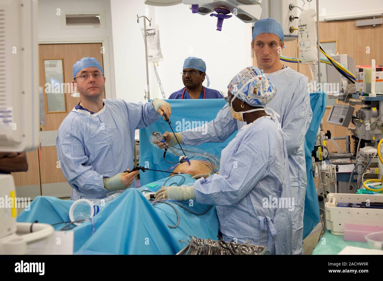 Cancer of the rectum surgery. Surgeons performing laparascopic (keyhole ...