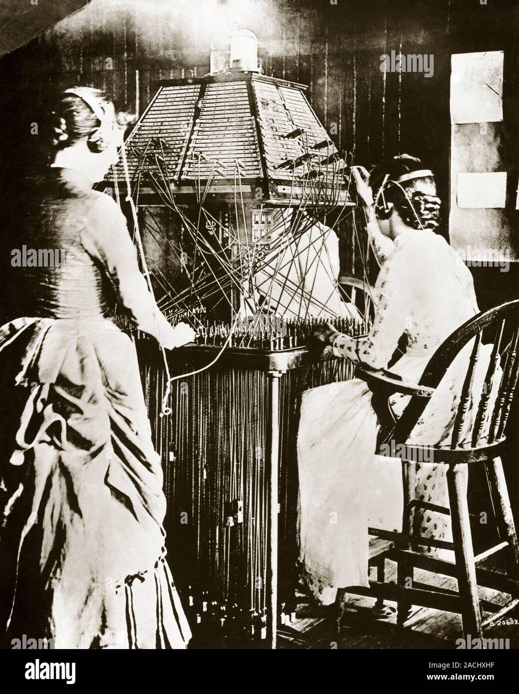 Pyramid telephone switchboard being operated by two women. This ...