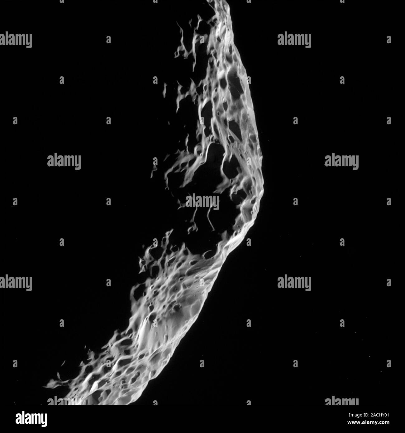 Saturn's moon Hyperion. Cassini spacecraft image of the cratered edge ...