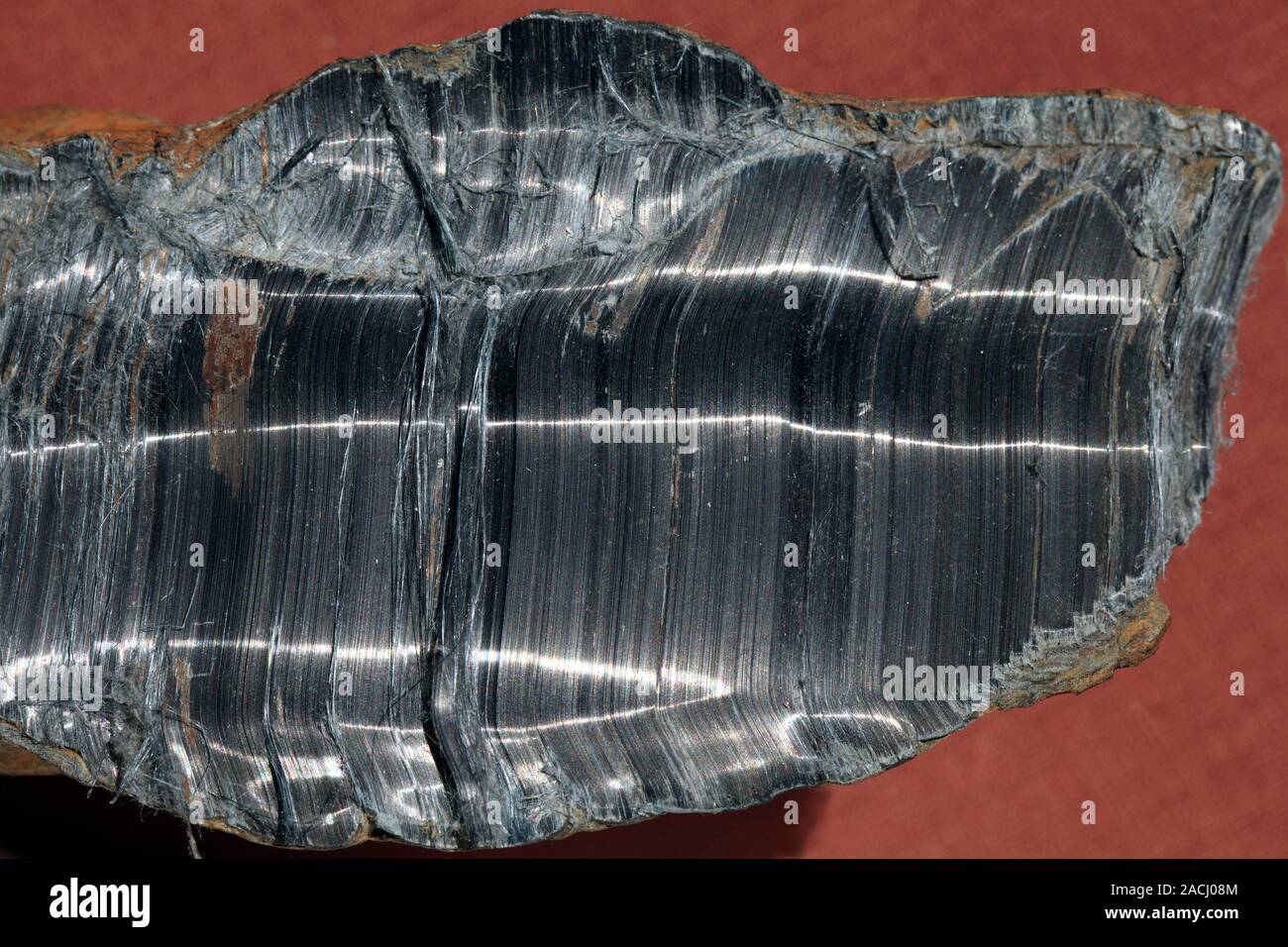 Crocidolite mineral. Crocidolite, or blue asbestos, is a dark blue ...