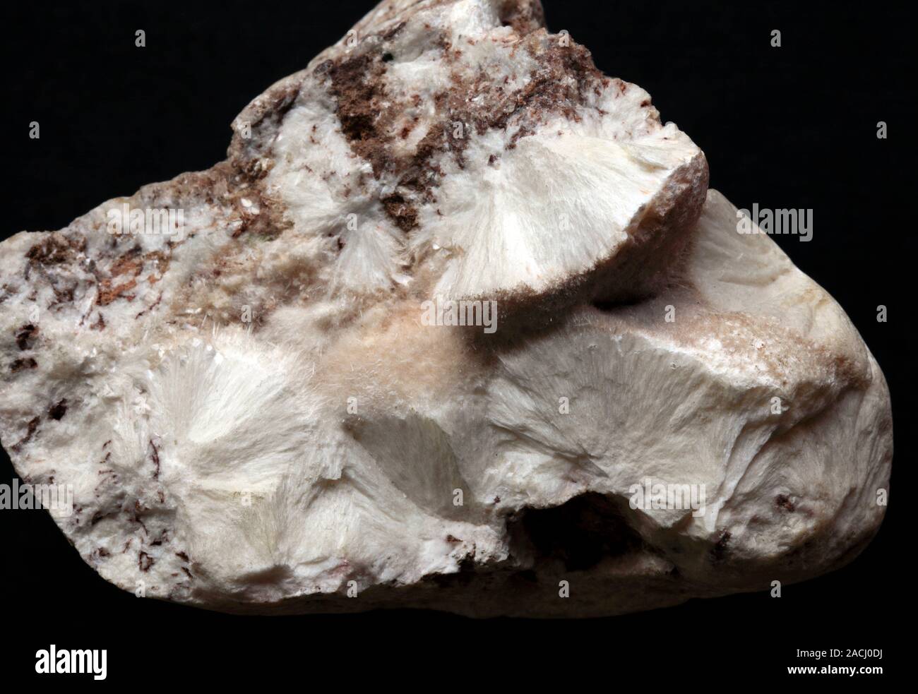 Mesolite crystals. Radiating crystals (white) of the mineral mesolite ...