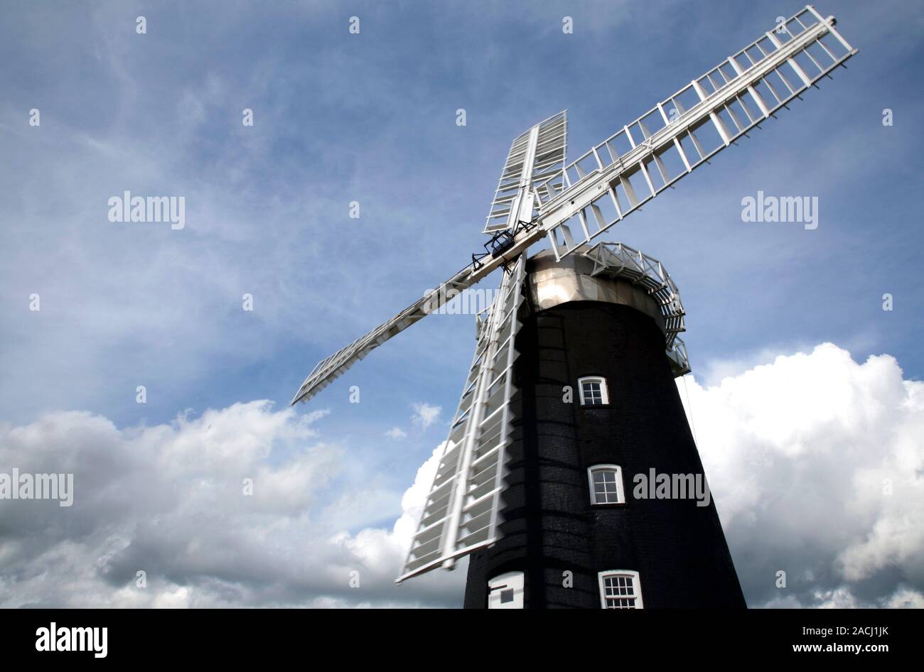 Converted windmill. This four-bladed windmill has been converted into a ...