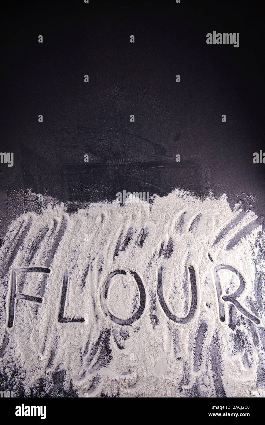 Word food written with flour on black background Stock Photo - Alamy