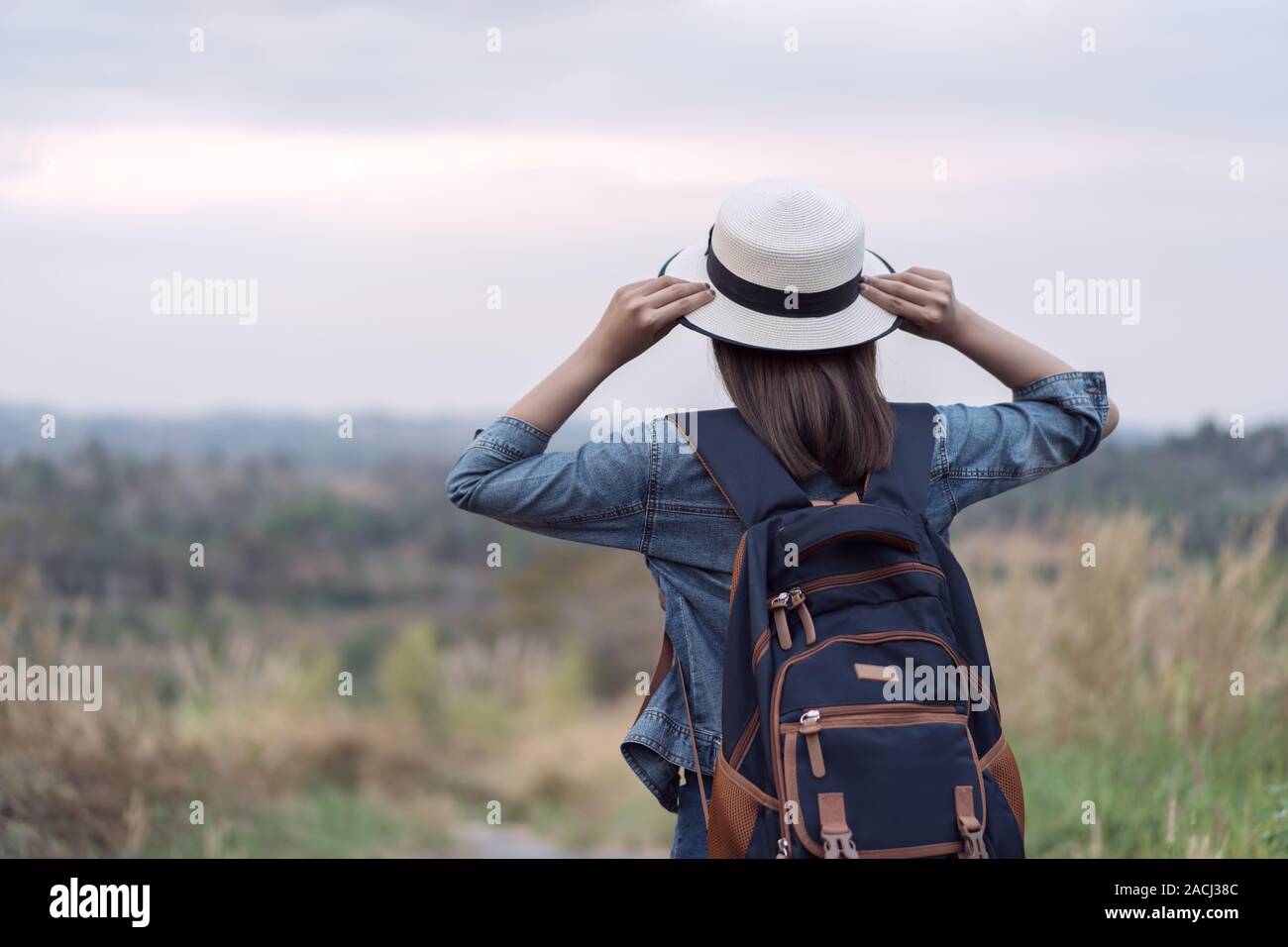 female tourist with backpack in the countryside Stock Photo - Alamy