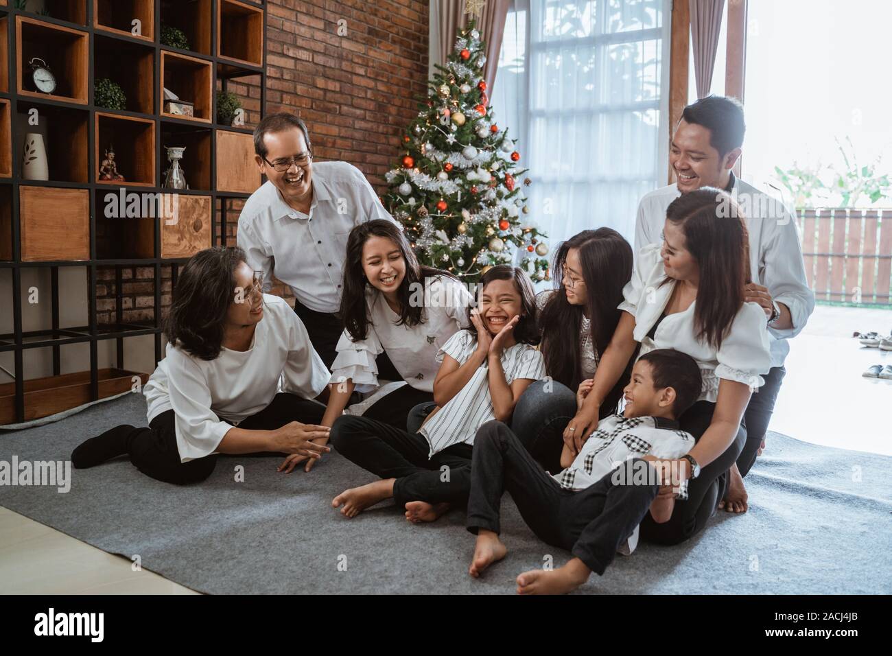 family and friend during christmas gathering Stock Photo - Alamy