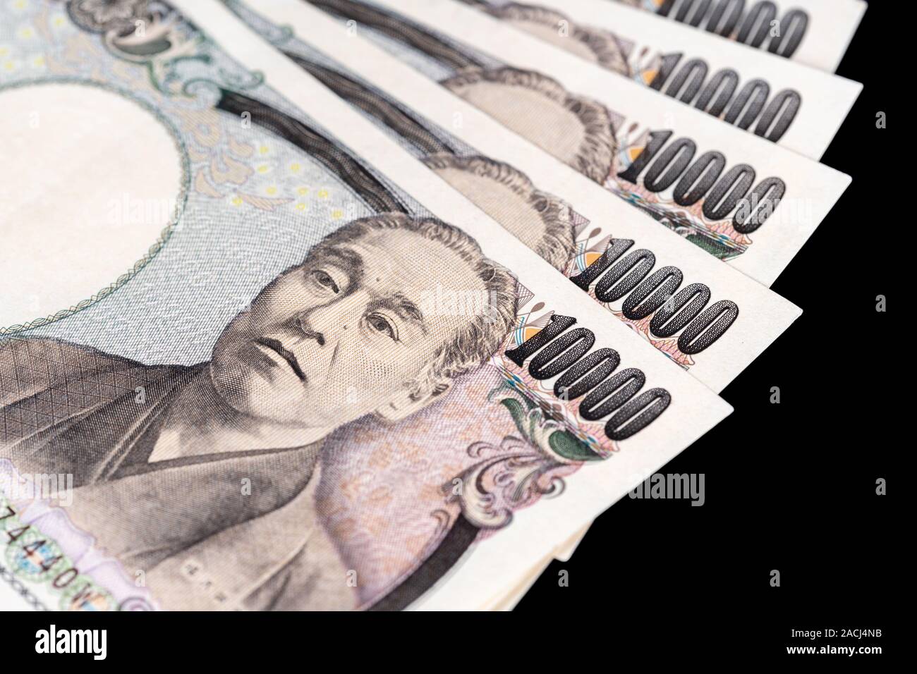 Japanese Banknote on black background, Yen is the official currency of ...