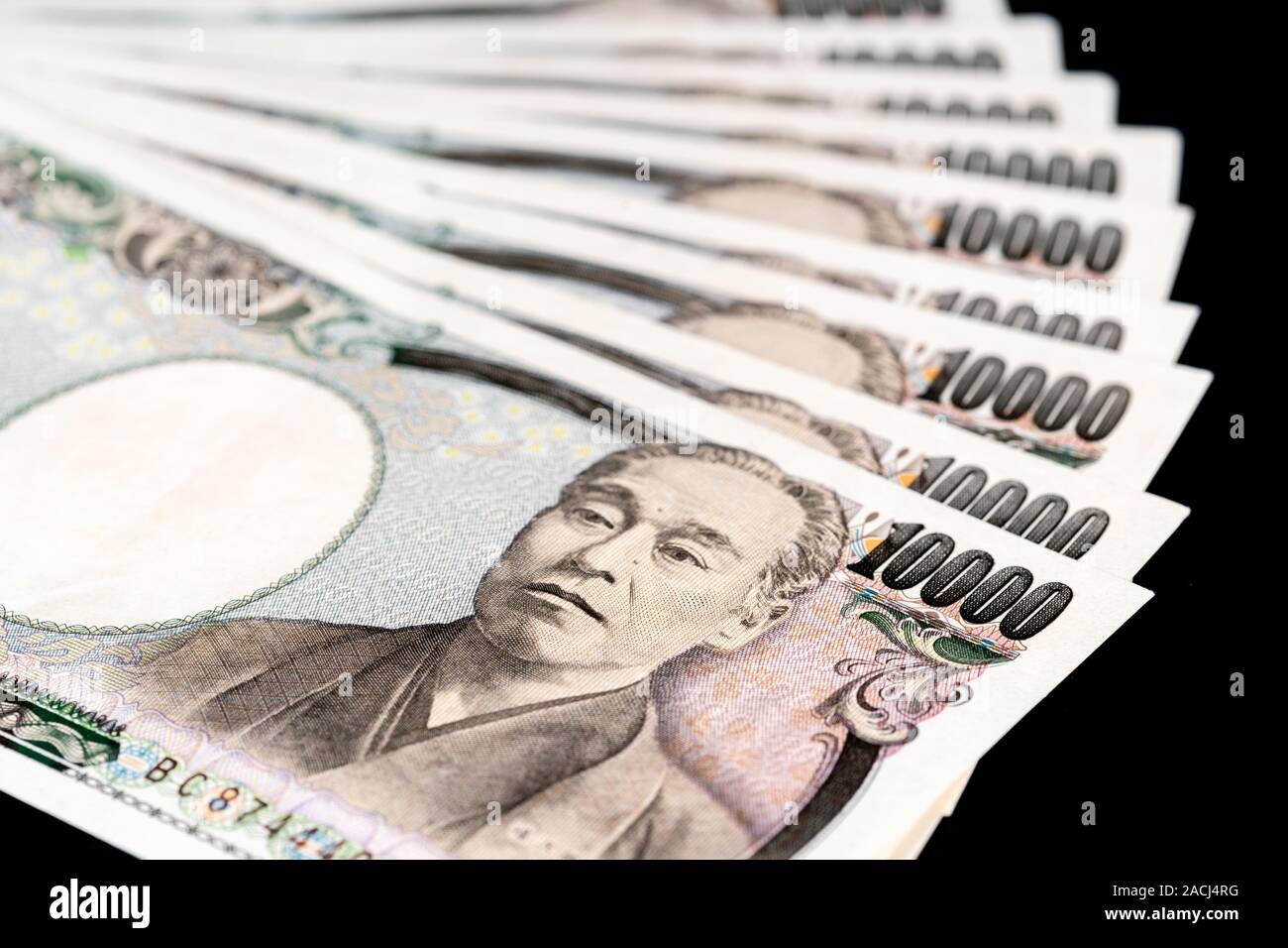 Japanese Banknote on black background, Yen is the official currency of ...