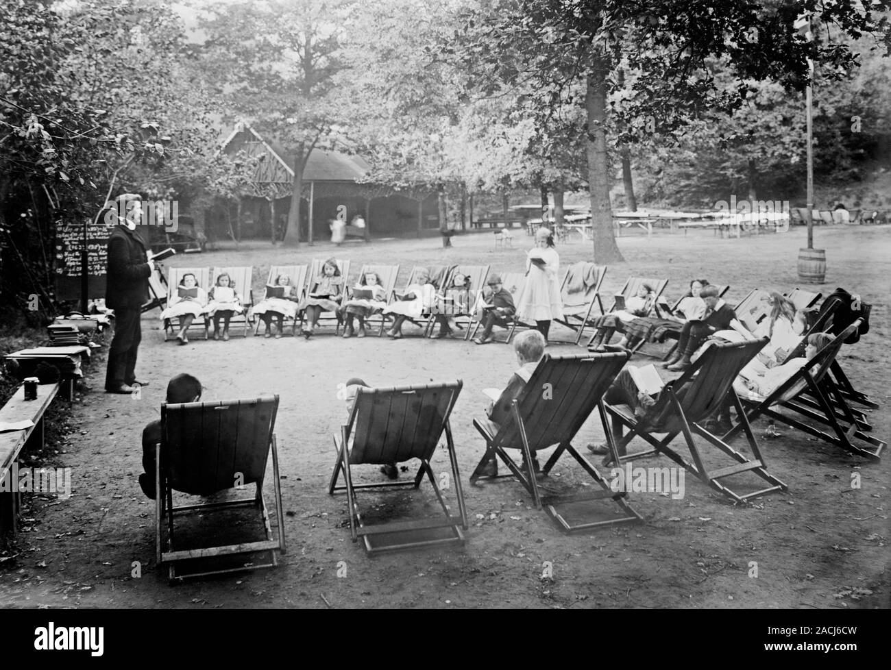 Open-air school, historical image. School children having a lesson ...