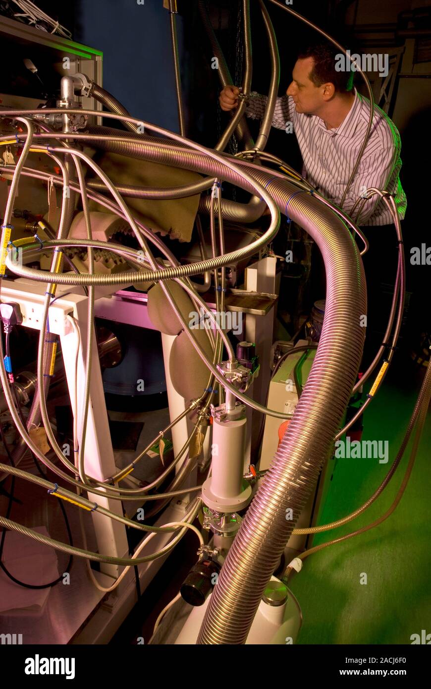 Counterfeit drug detection. Researcher working on an apparatus ...