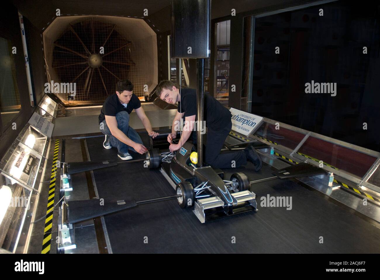 Race car testing. Engineering students testing a race car in a wind ...