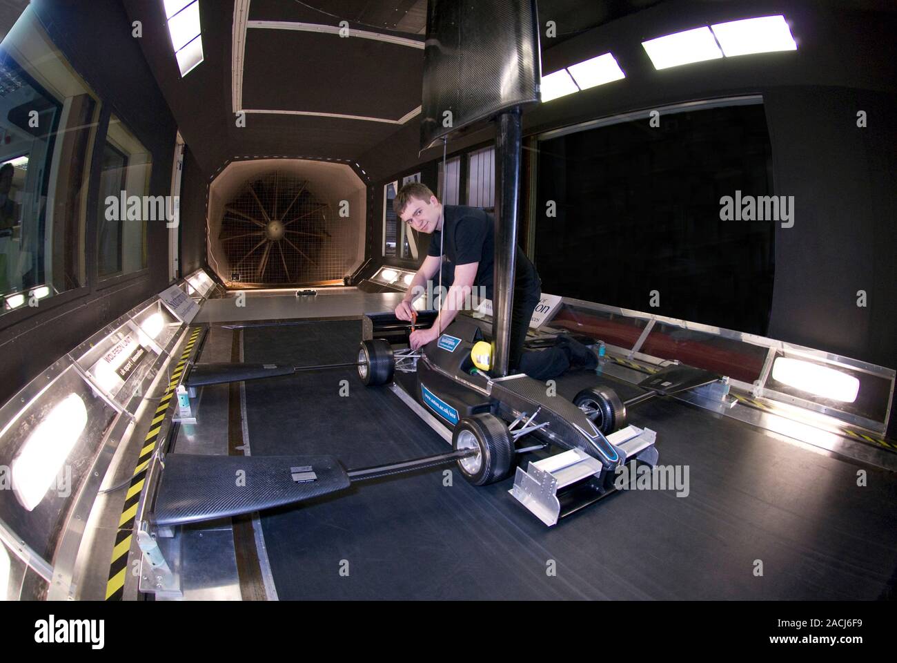 Race car testing. Engineering student testing a race car in a wind ...