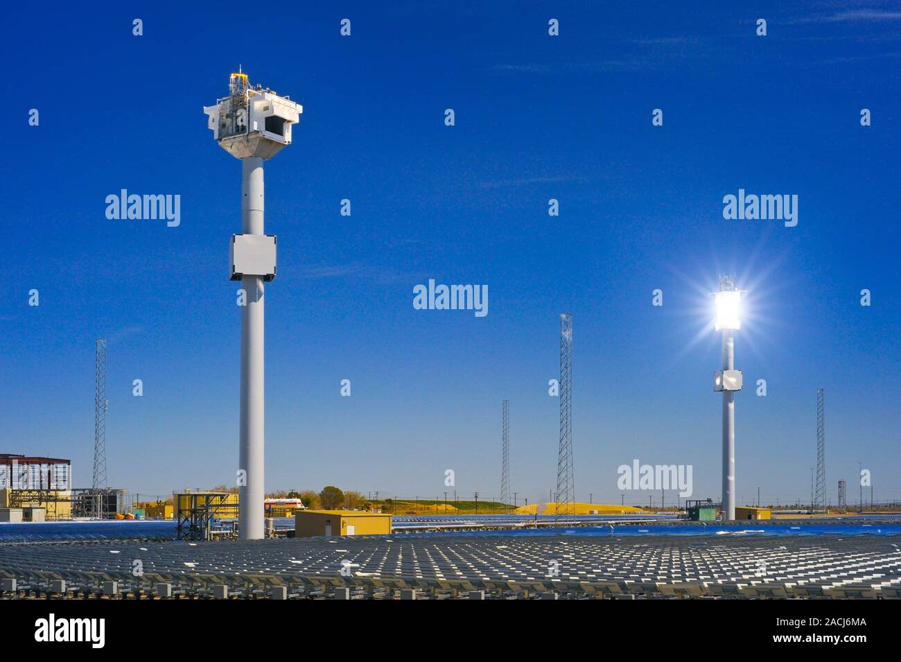 Concentrating solar power plant. Heliostat (mirrors with sun-tracking ...