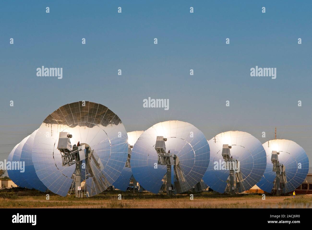 Concentrating solar power plant. Array of heliostats (mirrors with sun ...