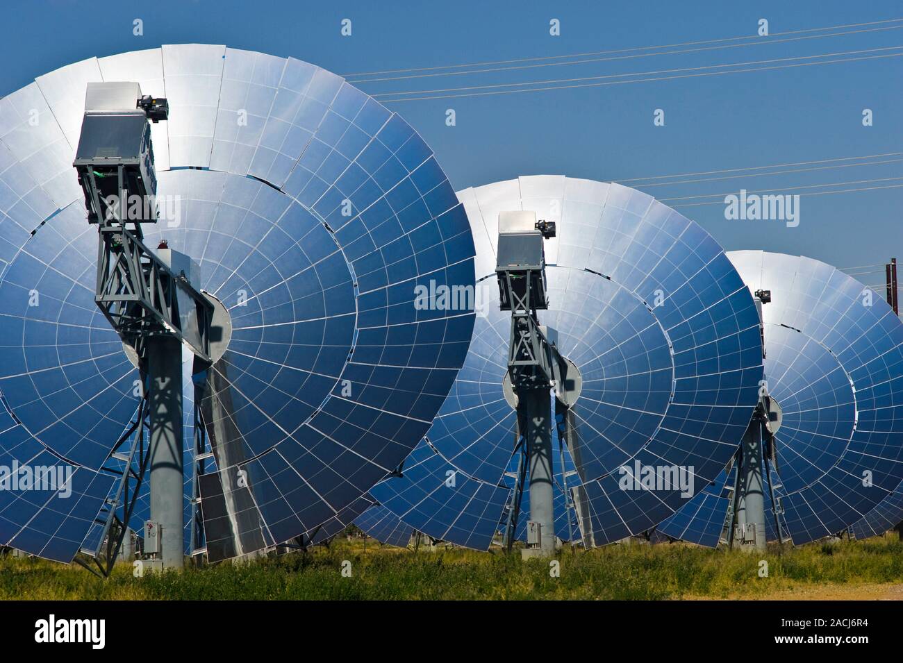 Concentrating solar power plant. Array of heliostats (mirrors with sun ...