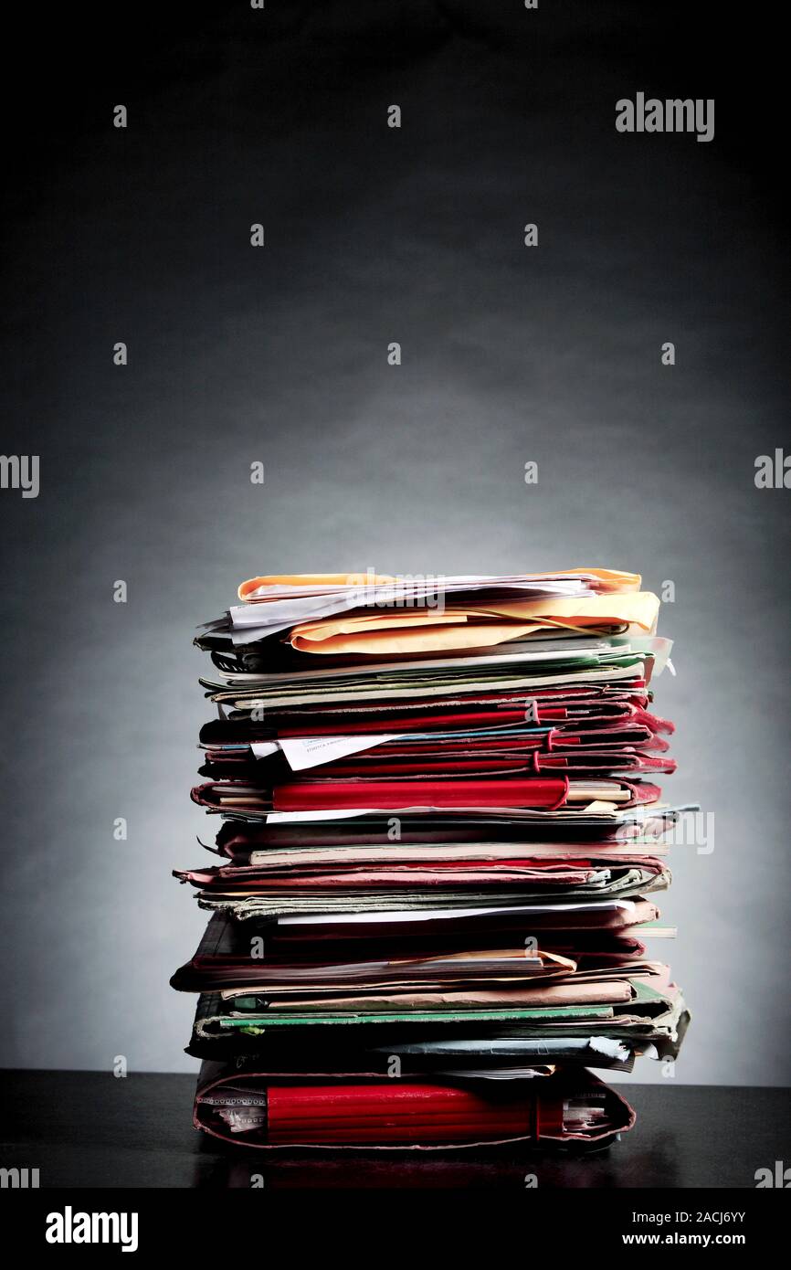 Workload, conceptual image. Large pile of folders on a desk Stock Photo ...