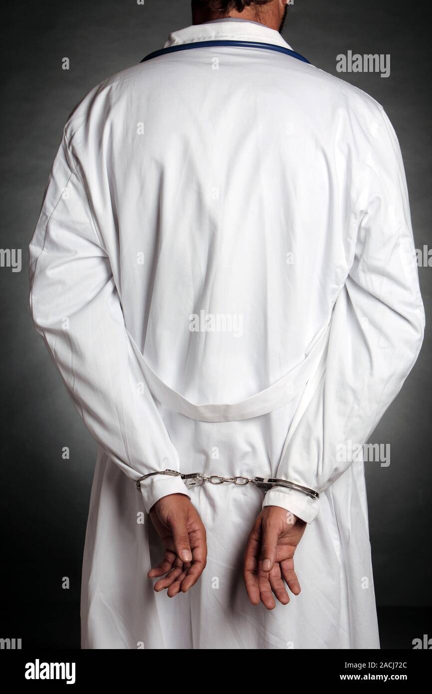 Medical malpractice, conceptual image. Doctor in handcuffs representing ...