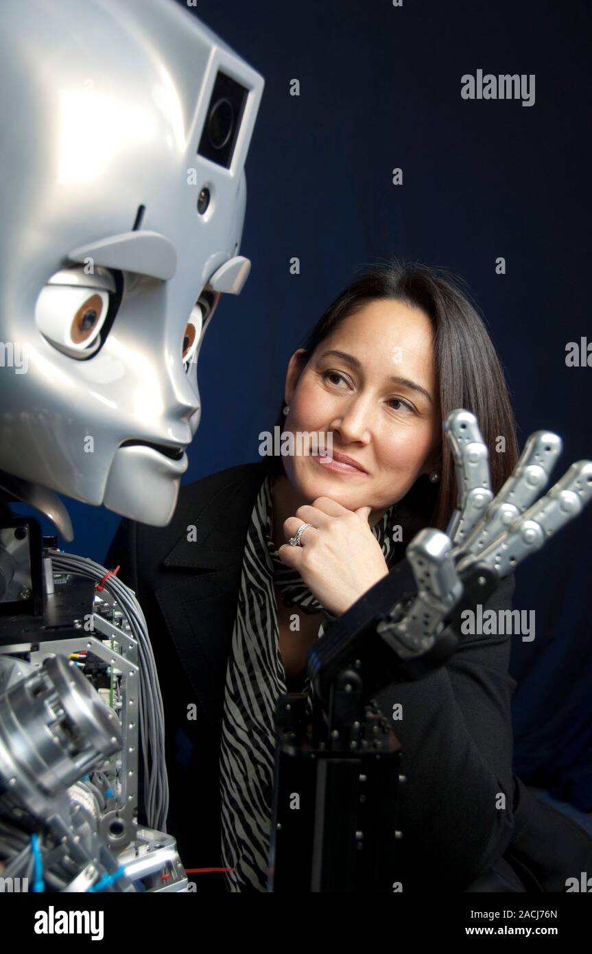 Humanoid social robot interacting with one of its developers. Close-up ...