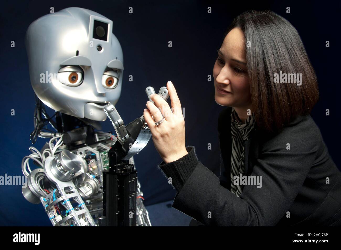 Humanoid social robot interacting with one of its developers. This is ...