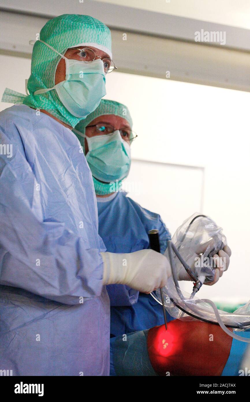 Knee arthroscopy. Orthopaedic surgeons using keyhole arthroscopy ...