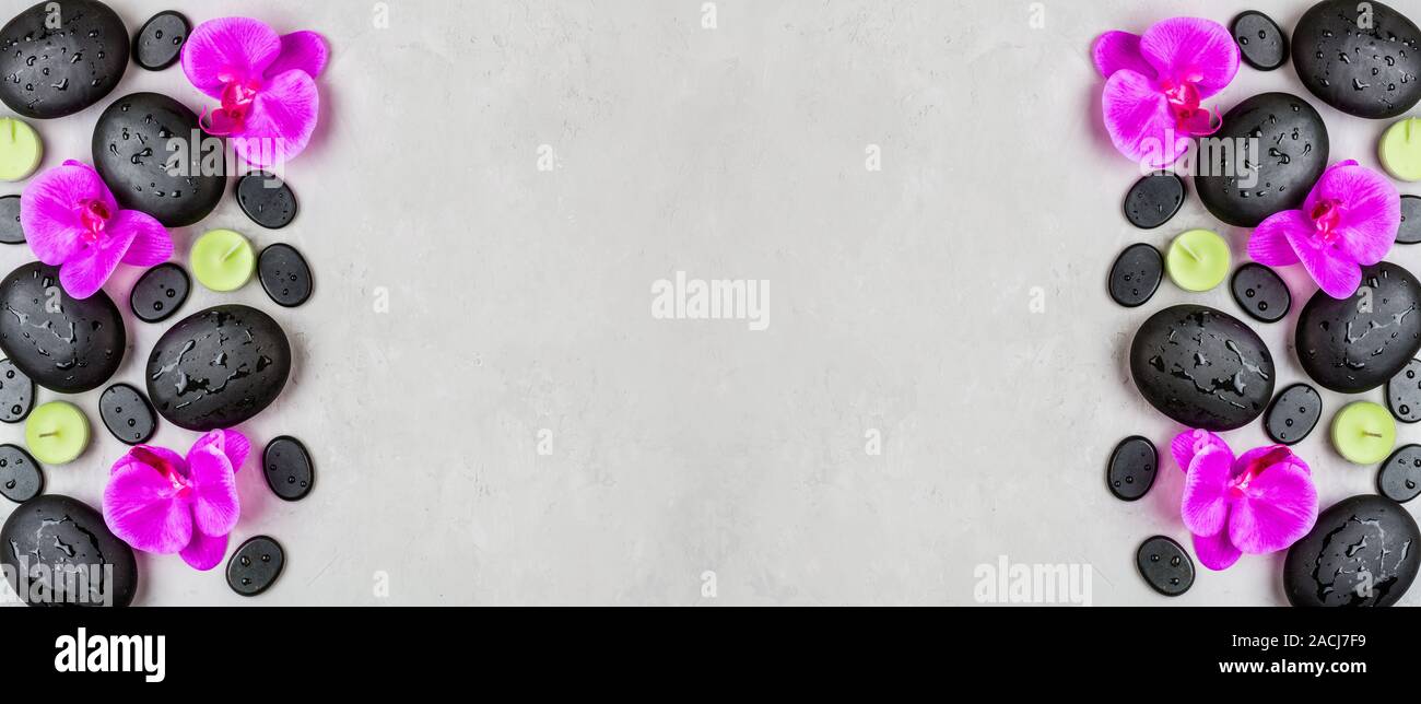 Top view of hot spa stones set for massage treatment and bamboo on ...