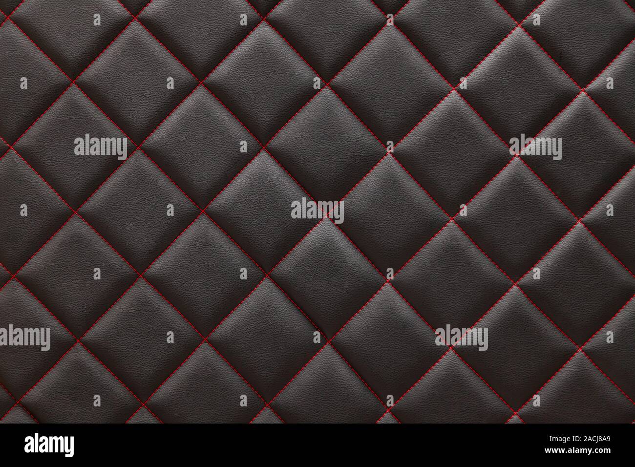 Black leather background and texture stitched with red diamond-shaped ...