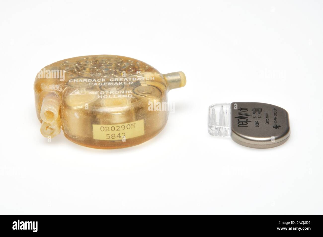 Pacemaker comparison. At left is a Chardack-Greatbatch pacemaker, which ...