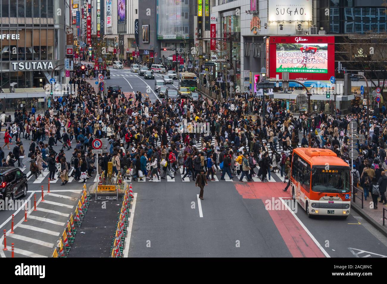 TOKYO , JAPAN - March 25, 2019: crowds of people walking across at ...