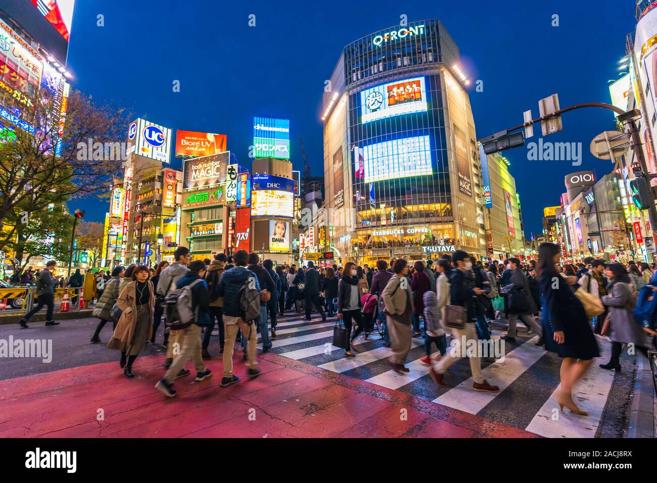 TOKYO , JAPAN - March 25, 2019: crowds of people walking across at ...