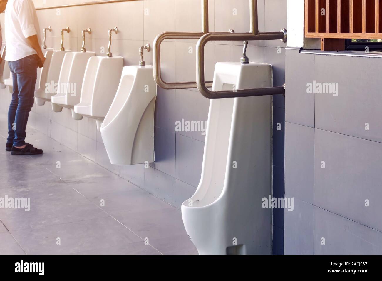 Clean and modern public men toilet with friendly design for people with ...