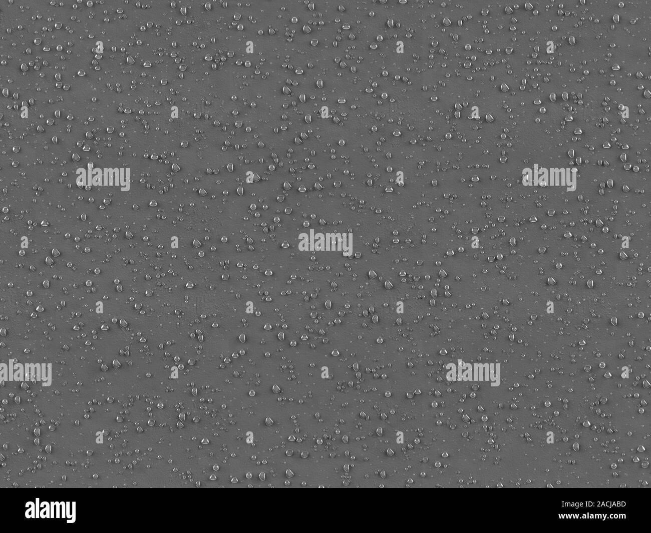 A closeup of tiny water droplets and condensation on a black textured ...