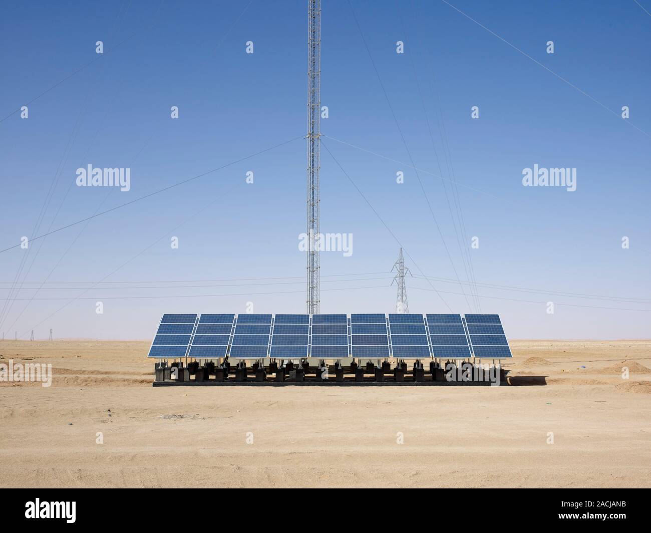 Microwave telecommunications relay tower powered by an array of ...