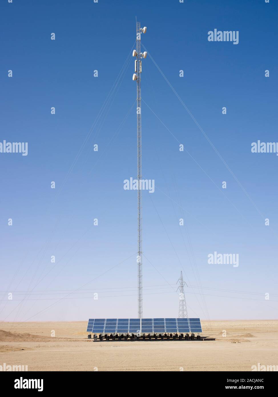 Microwave telecommunications relay tower powered by an array of ...